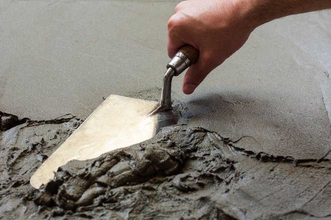 How to Level Concrete Flooring | DoItYourself.com