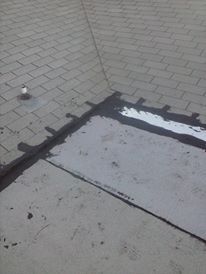 Tieing a cold application tar roof into an existing shingle roof ...