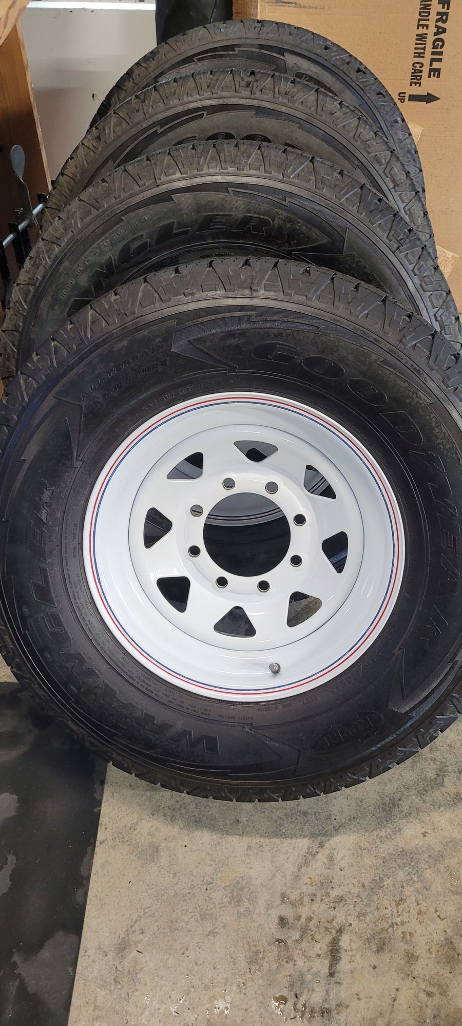 Set of four 16x7 8x6.5 White spokes with Goodyear 265/70/16 tires ...
